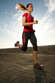 Blonde model running in fitness attire. - Stock Image - Everypixel