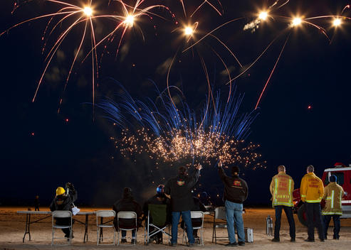 Firefighters and pyrotechnic specialists watch fireworks they are ...