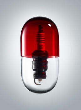 Spark plug in a glass pill - Stock Image - Everypixel